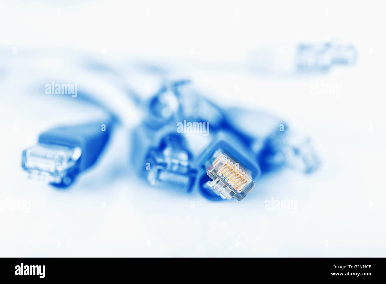 shallow DOF blue network cable with connectors. Selective focus Stock ...