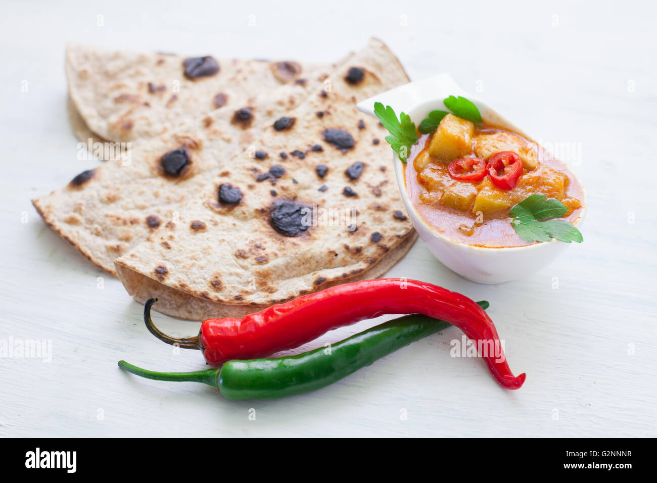 Indian tikka masala chicken and naan flat bread Stock Photo - Alamy