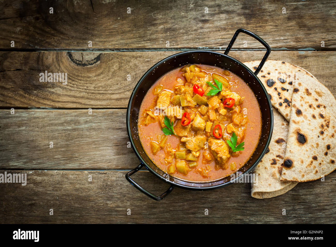Indian tikka masala chicken and naan flat bread Stock Photo - Alamy