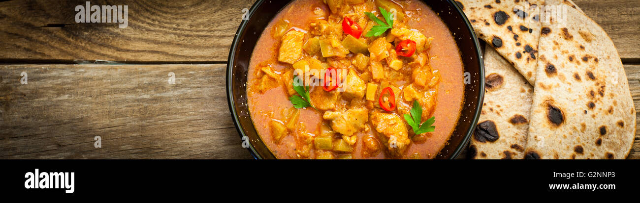 Indian tikka masala chicken and naan flat bread Stock Photo - Alamy
