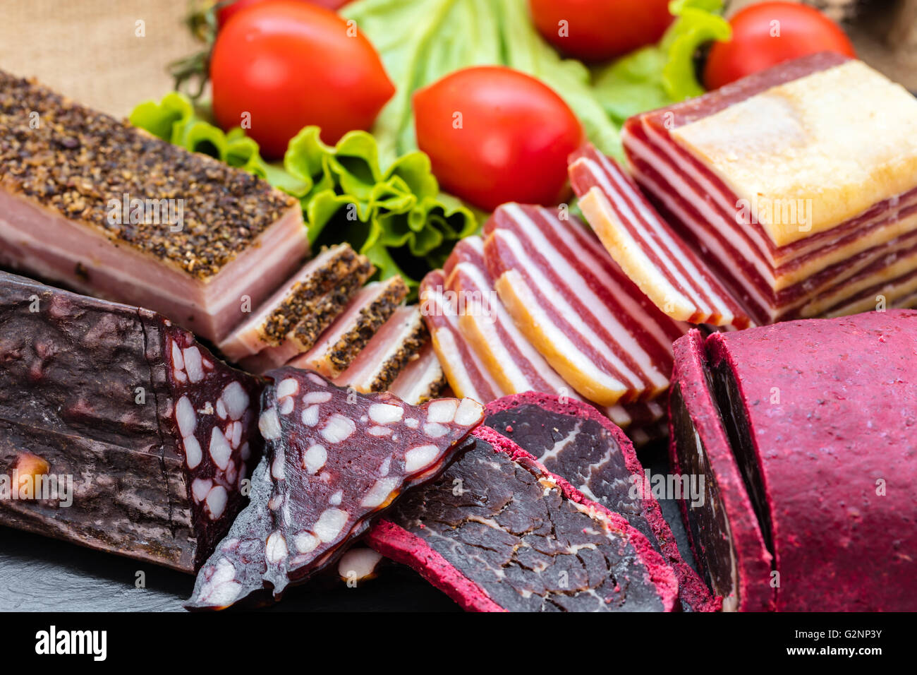 assorted meat of sausages and vegetables close-up Stock Photo - Alamy