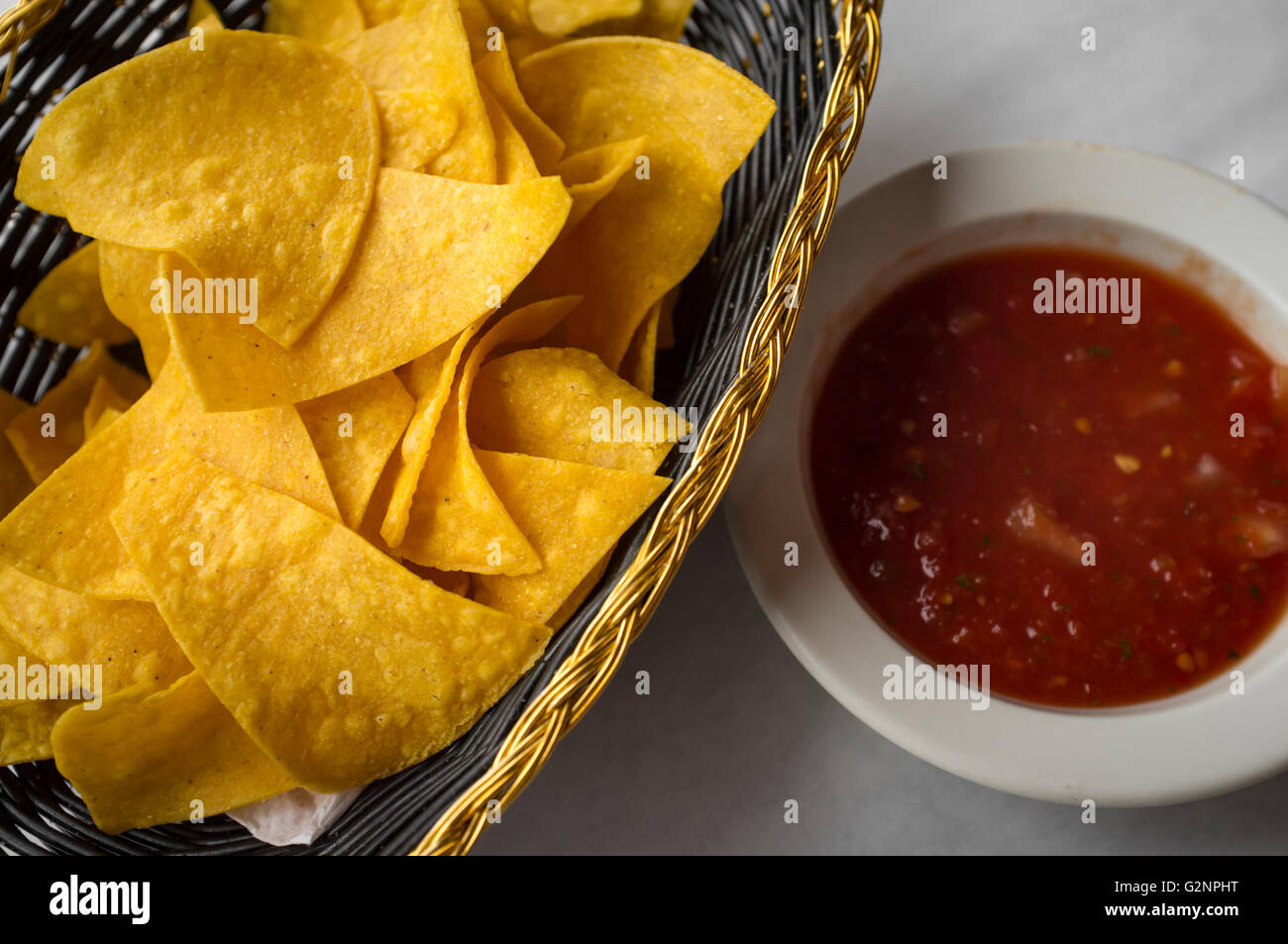 Mexican crispy tortilla chips with spicy red tomato salsa Stock Photo ...