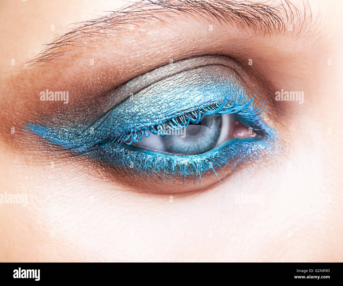 Close-up shot of female eye blue color make-up Stock Photo - Alamy