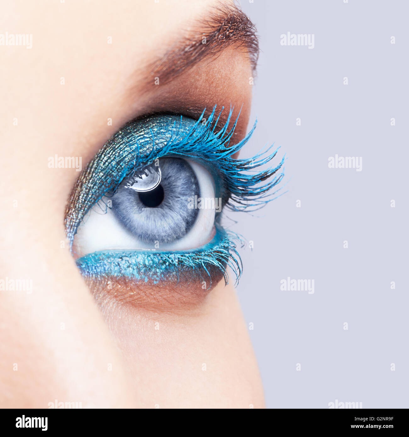 Close-up shot of female eye blue color make-up Stock Photo - Alamy