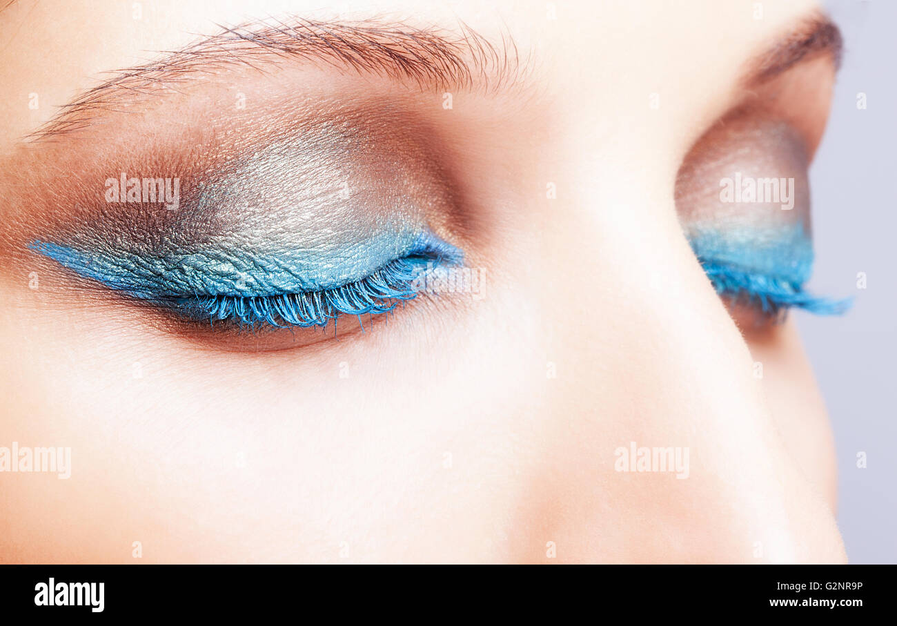 Close-up shot of closed female eyes blue color make-up Stock Photo - Alamy