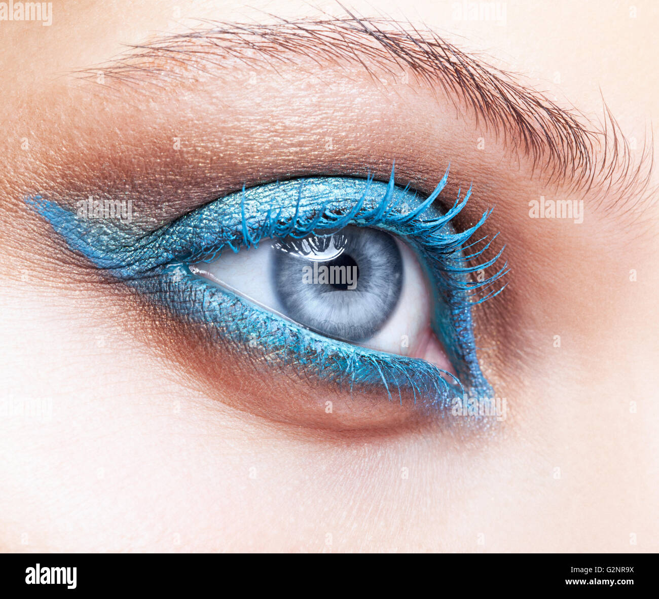 Close-up shot of female eye blue color make-up Stock Photo - Alamy