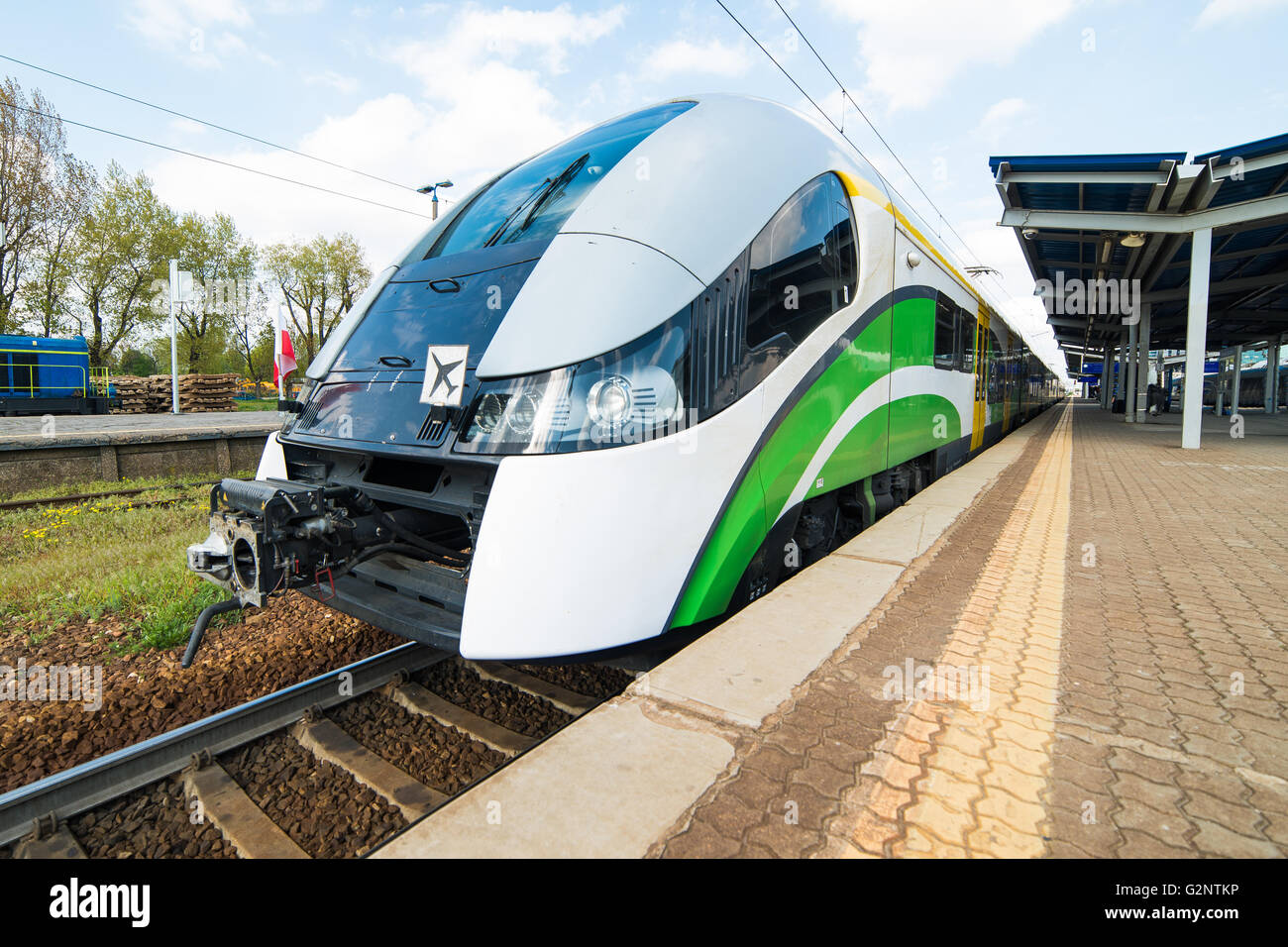 modern train standing at railway station Stock Photo - Alamy