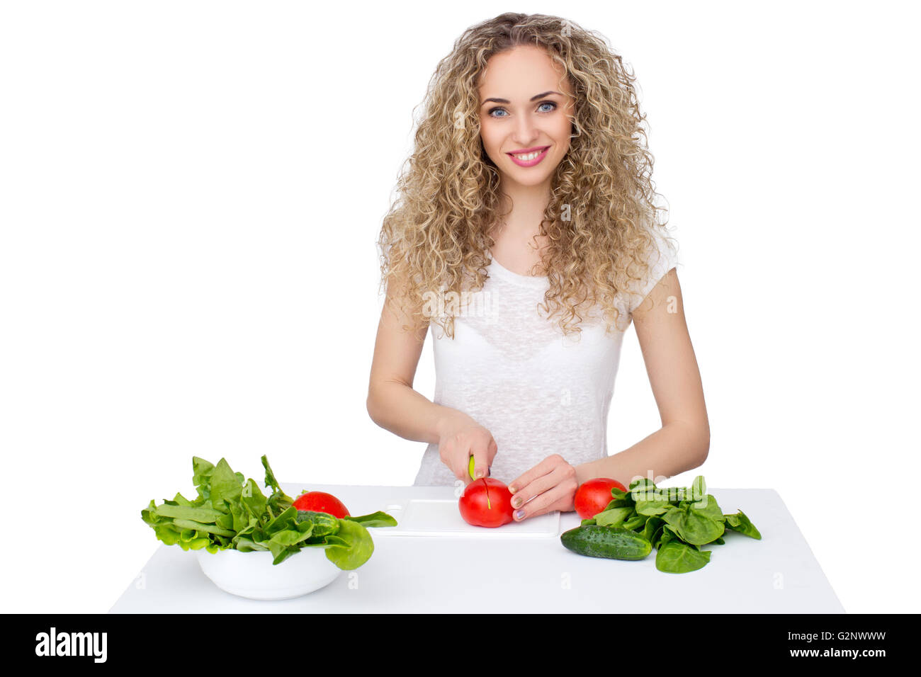 Woman making salad in kitchen Stock Photo - Alamy