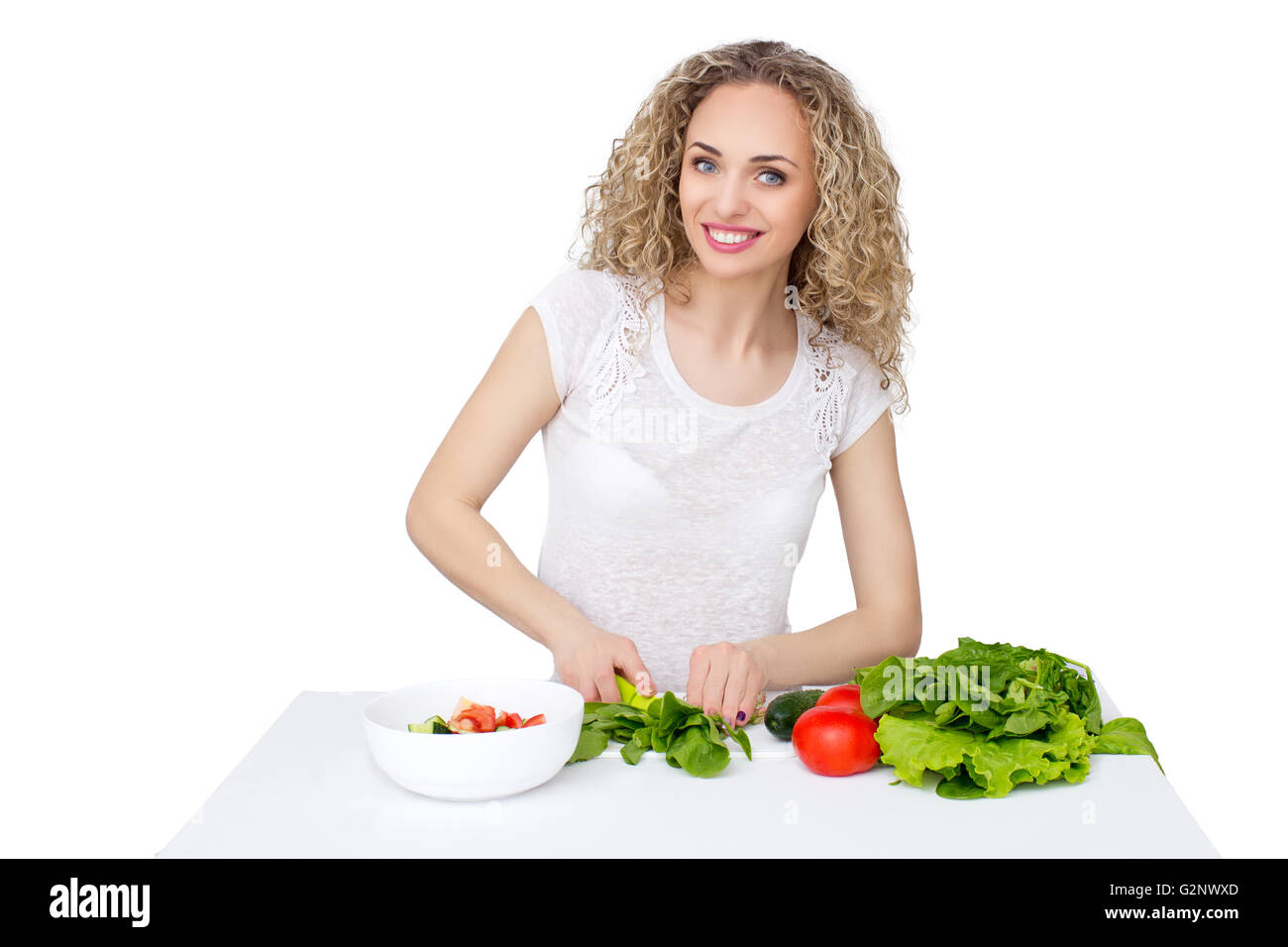 Woman making salad in kitchen Stock Photo - Alamy