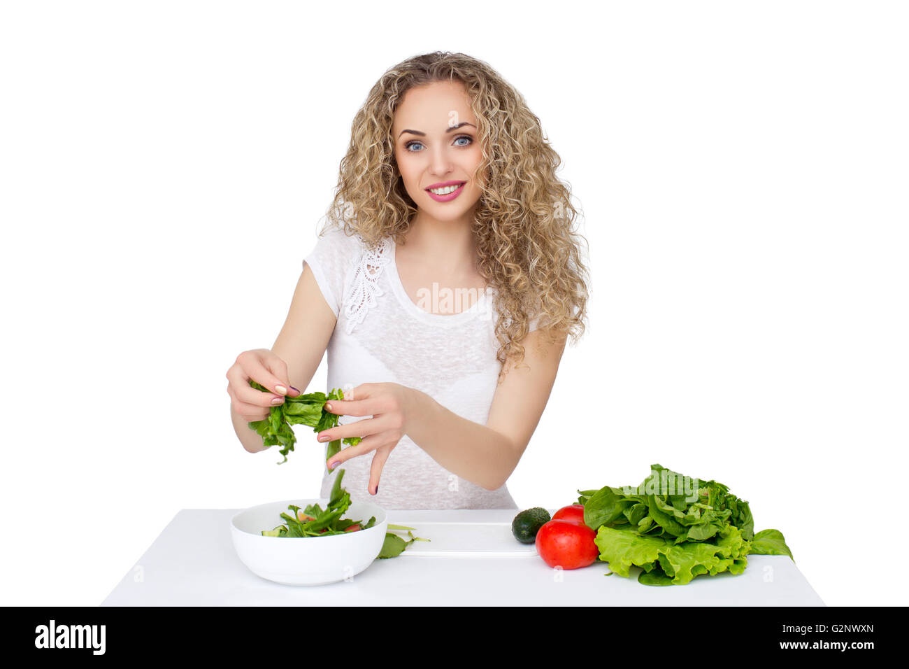 Woman making salad in kitchen Stock Photo - Alamy