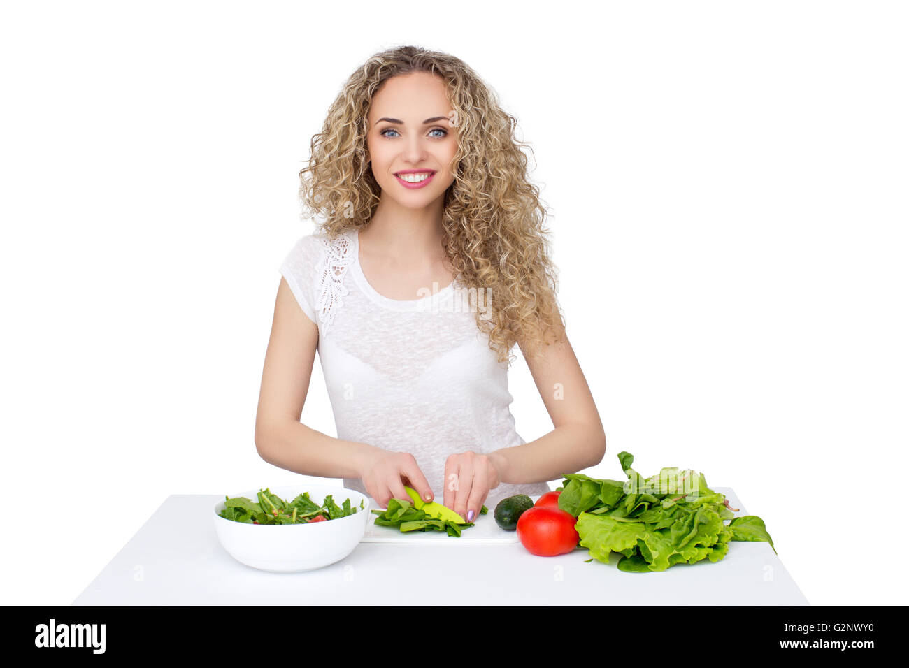 Woman making salad in kitchen Stock Photo - Alamy