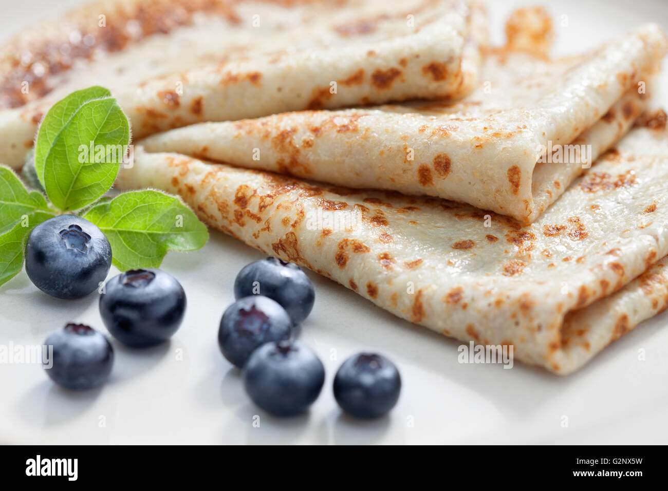 close up view of nice yummy crepes with berry on twhite Stock Photo - Alamy
