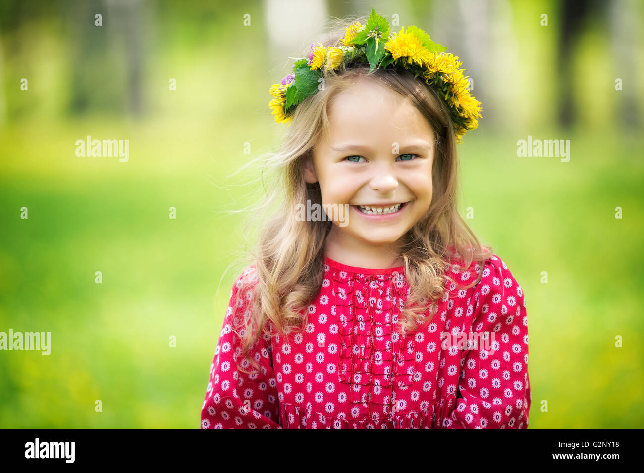 Little girl in spring park Stock Photo - Alamy