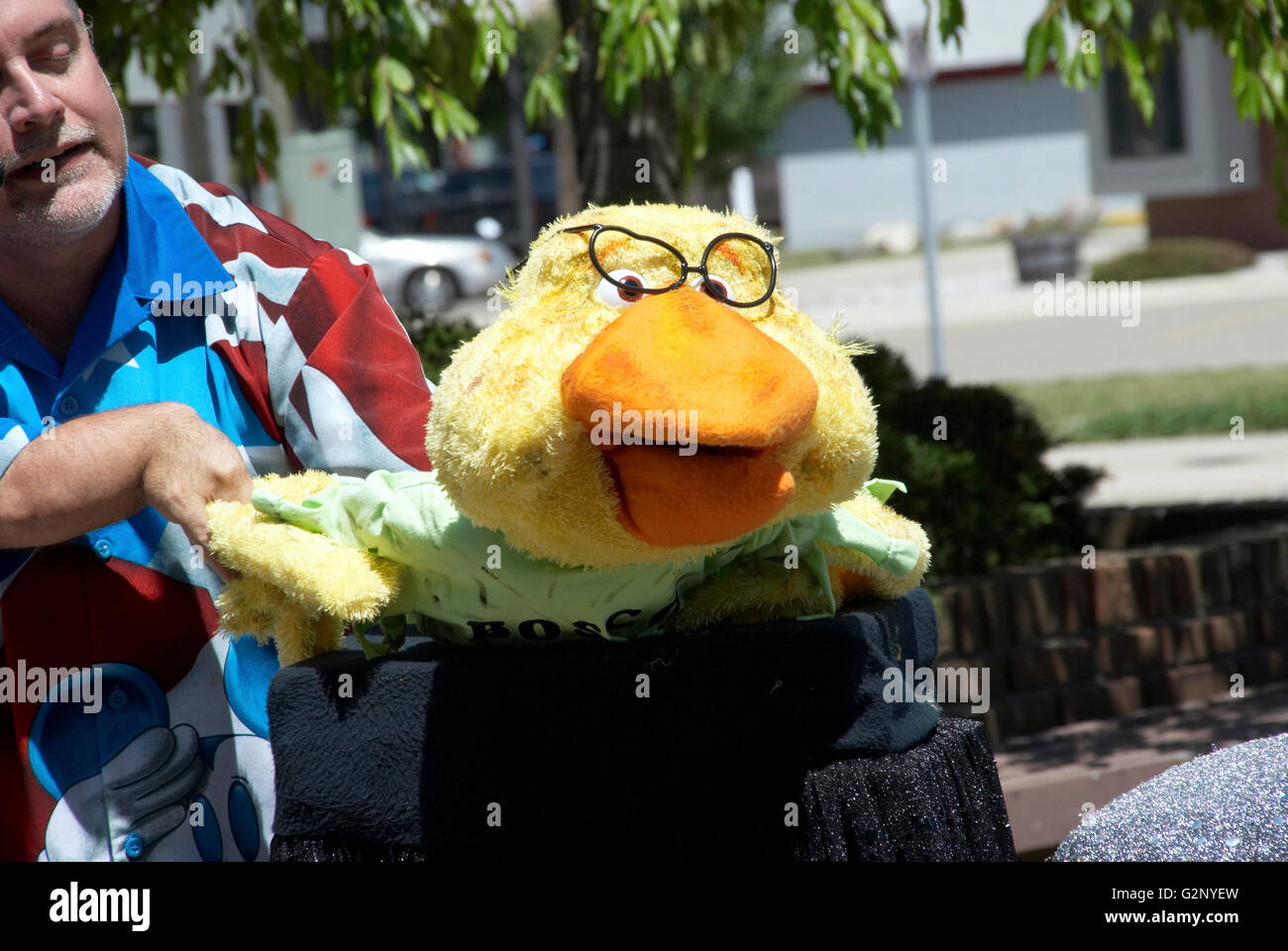 Ventriloquist Richard Paul with his puppet Bosco at a sidewalk festival ...