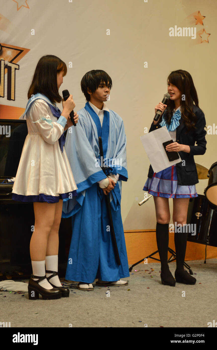 Master of ceremonies interviewing cosplayer in cosplay competition at ...