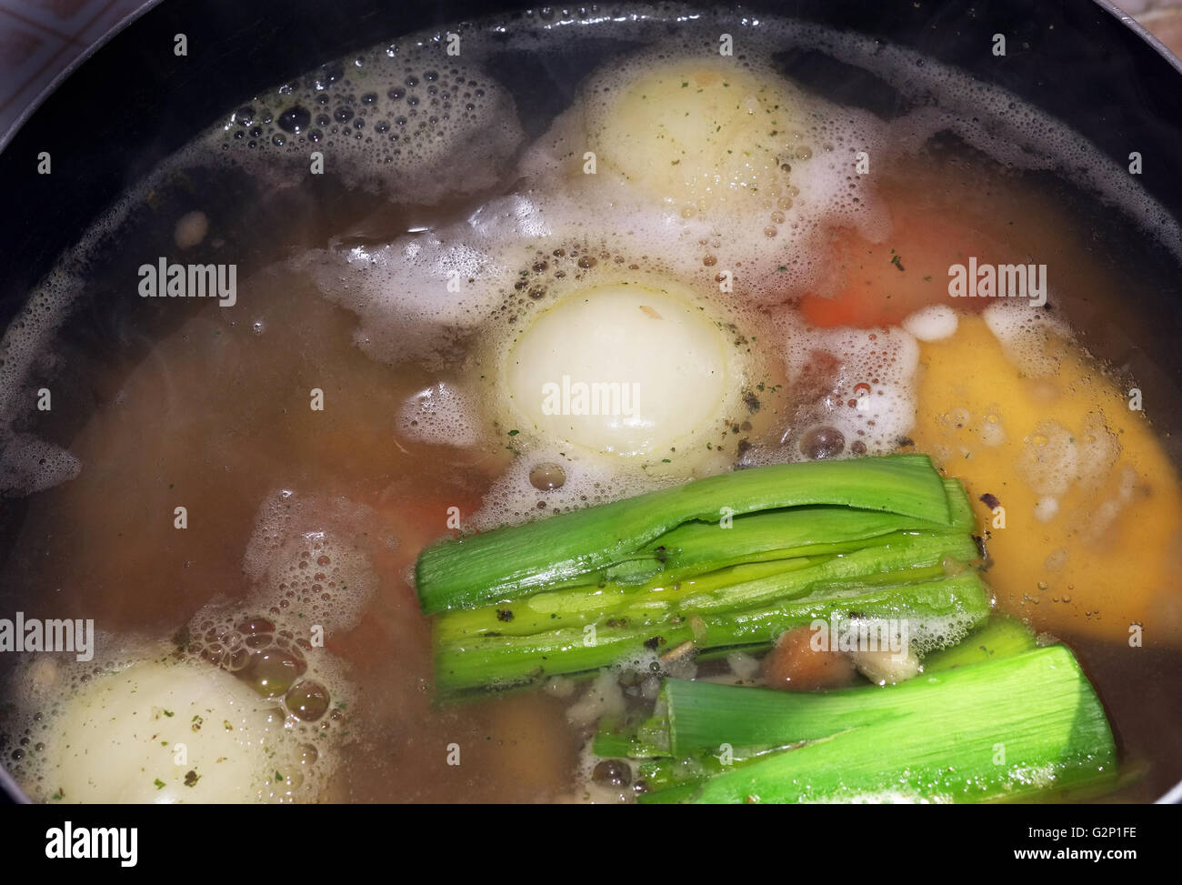 Vegetables boiling in pan to make stock Stock Photo - Alamy