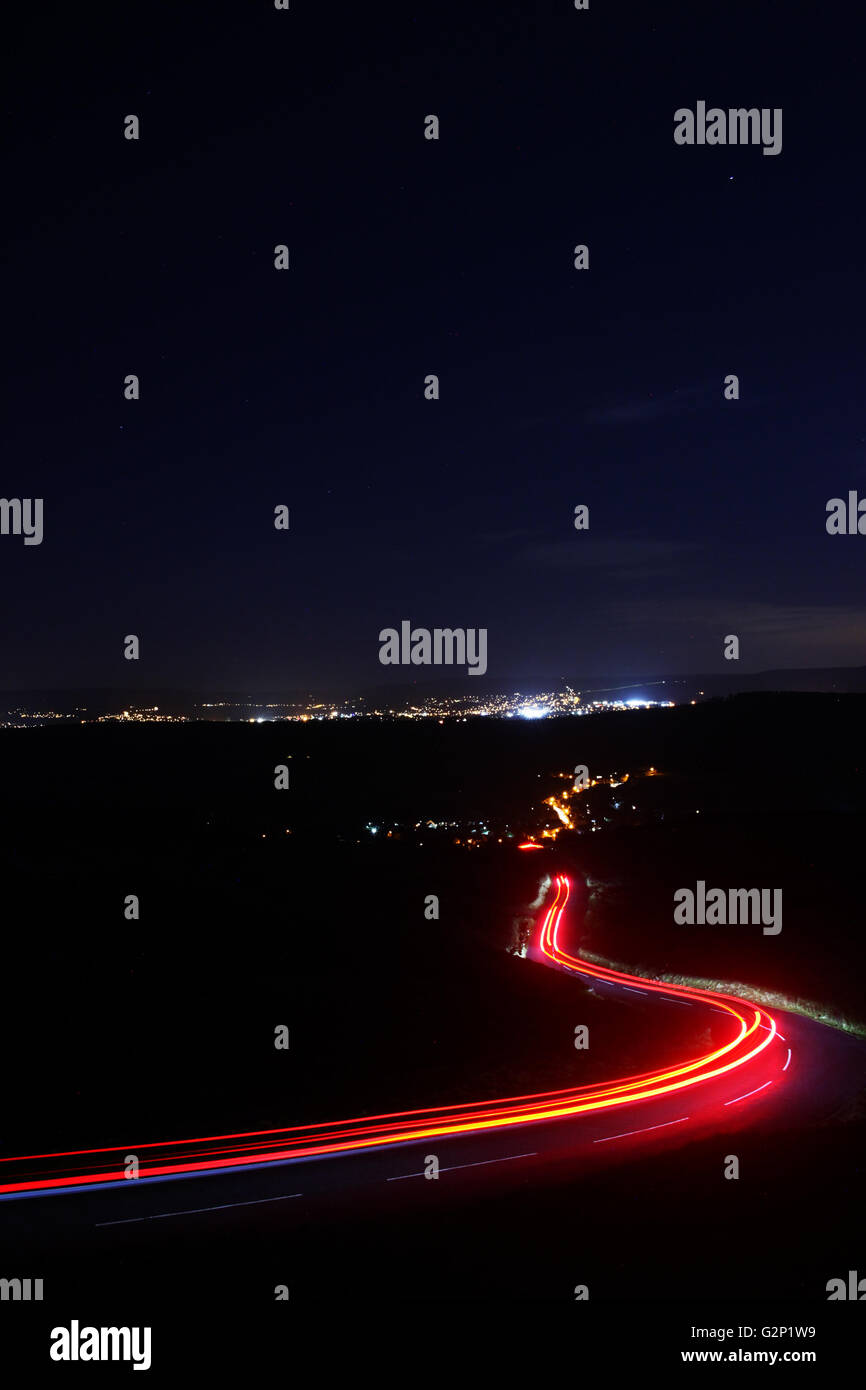 Car lights road under starlight Stock Photo - Alamy