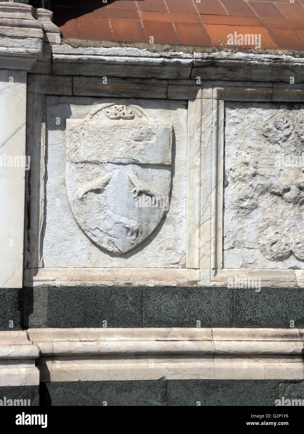 External detail from a church in Florence, Italy. Stonework reliefs ...