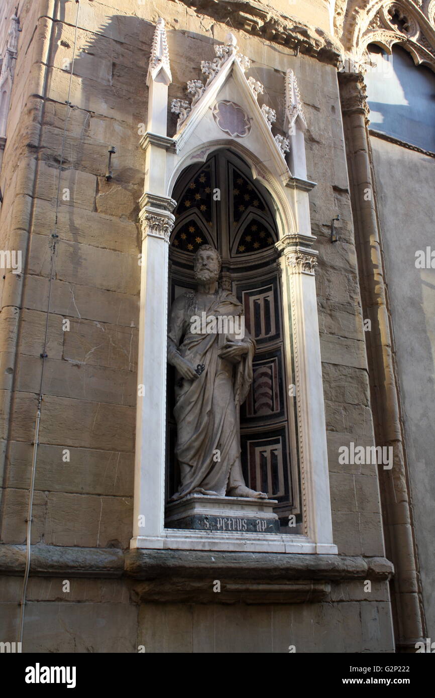Statue detail on the outside of a church in Florence, Italy. Semi ...