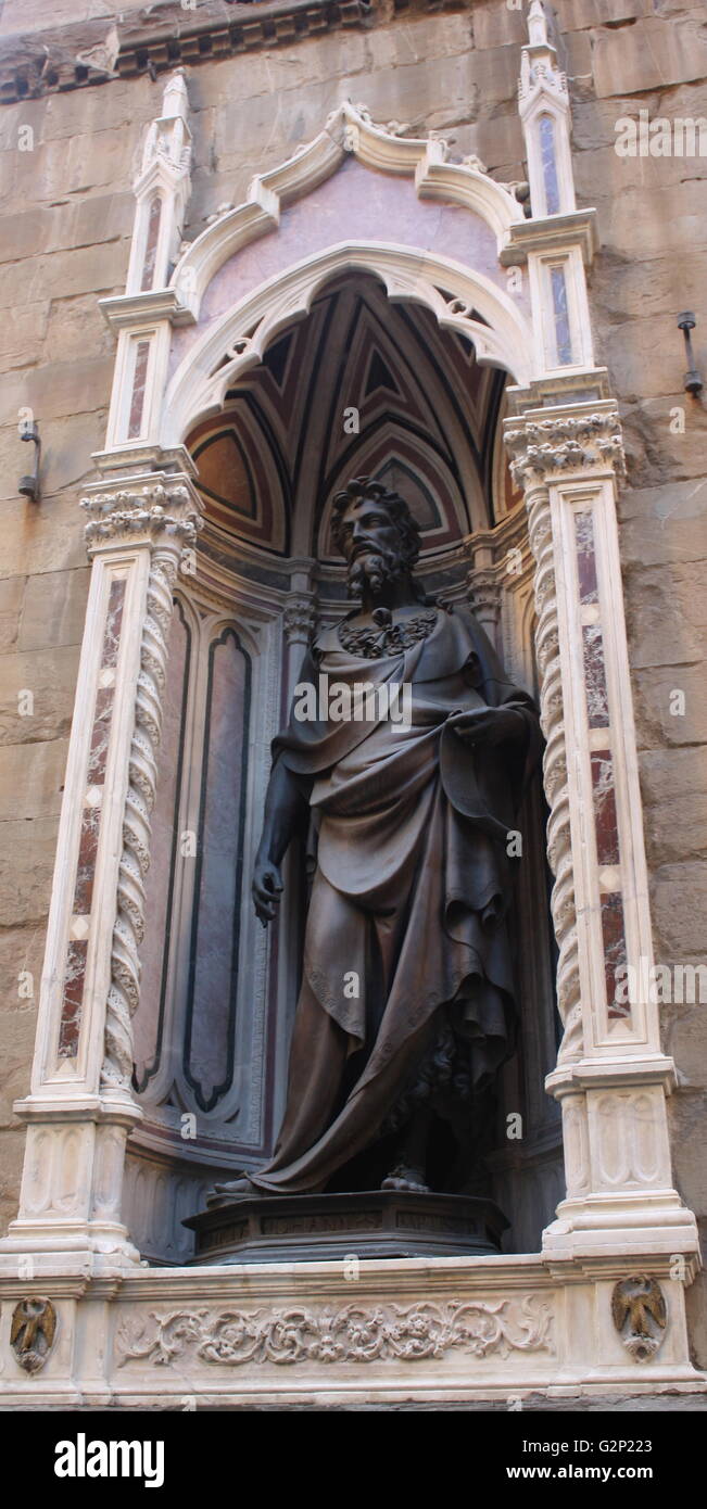 Statue detail on the outside of a church in Florence, Italy. Semi ...