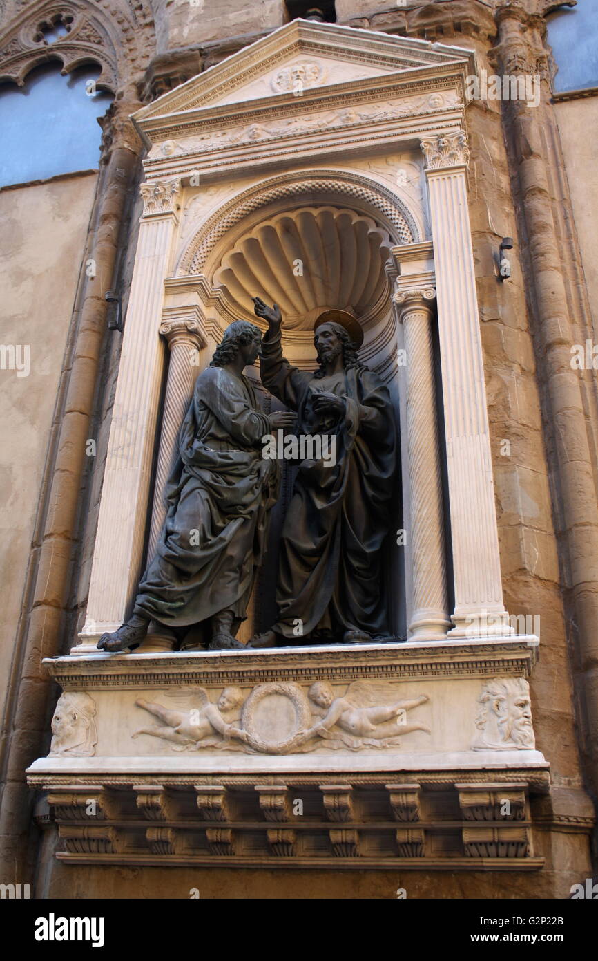 Statue detail on the outside of a church in Florence, Italy. Semi ...