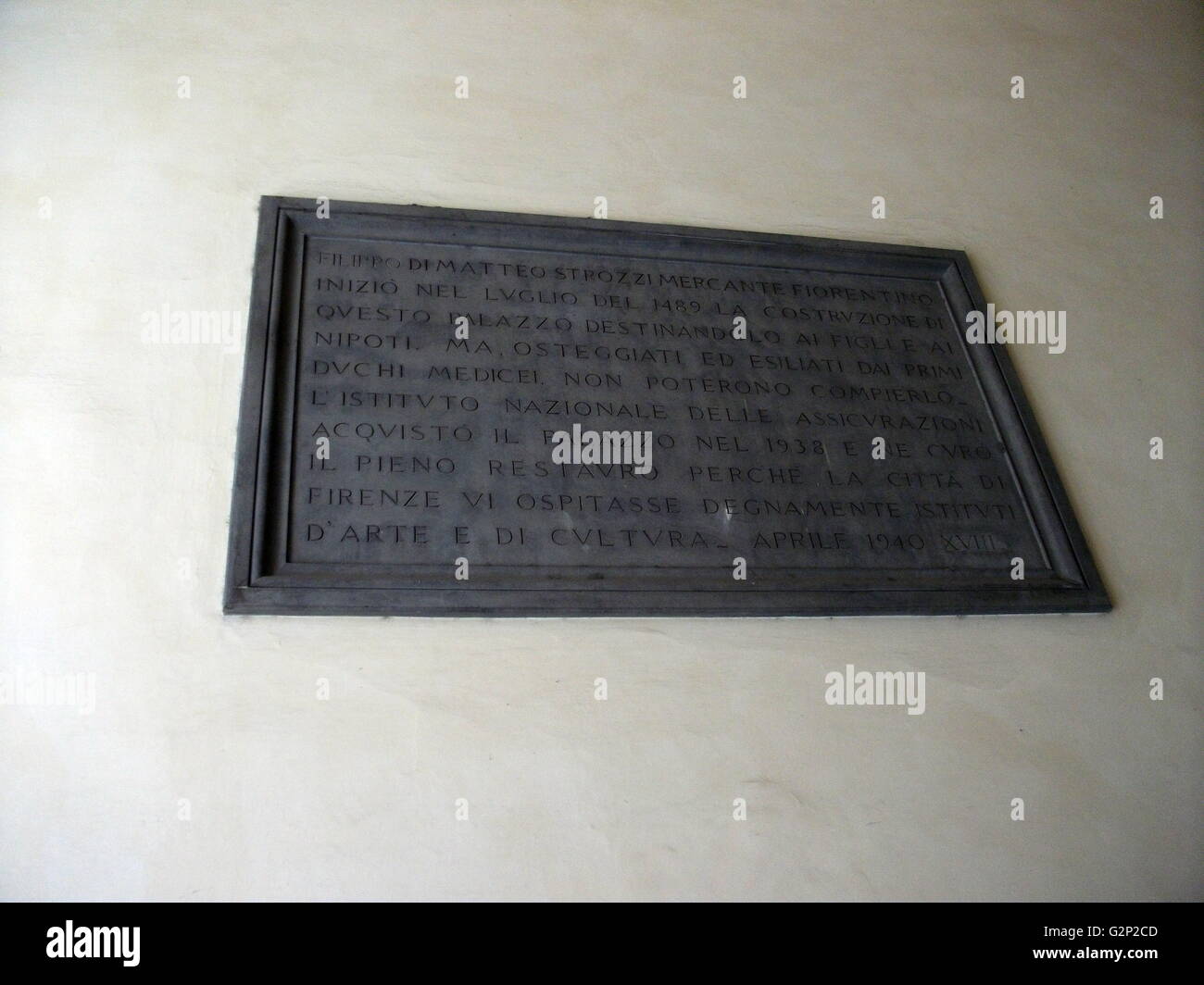 Latin inscription detail from the Palazzo Strozzi in Florence, Italy. A ...