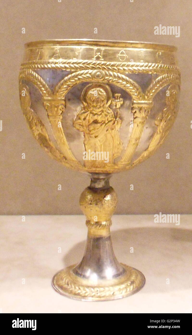 Silver gilded Chalice. In relief it shows a young Christ with halo ...