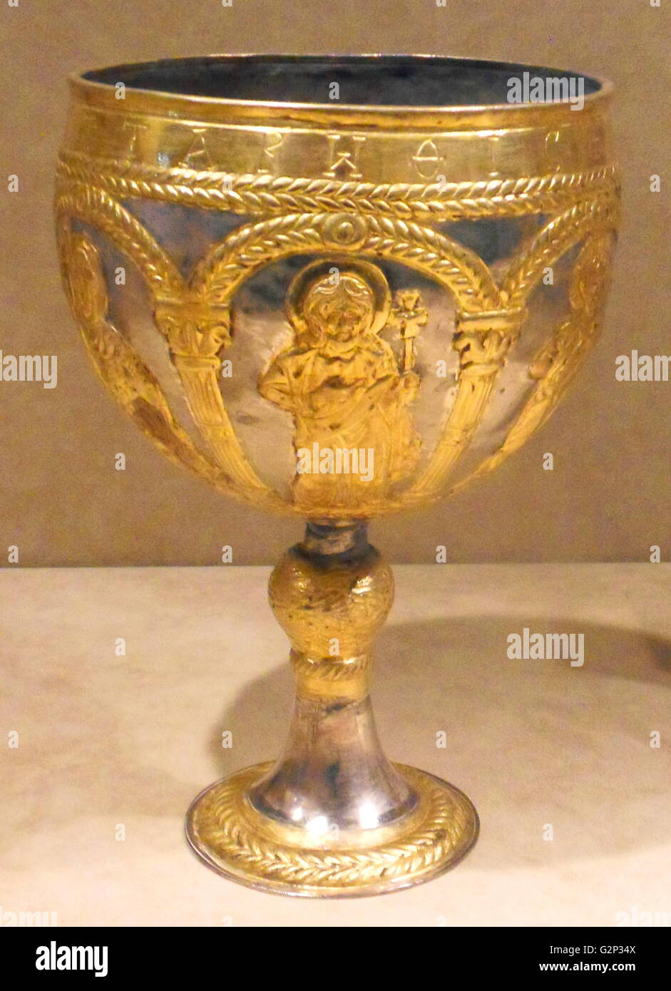 Silver gilded Chalice. In relief it shows a young Christ with halo ...