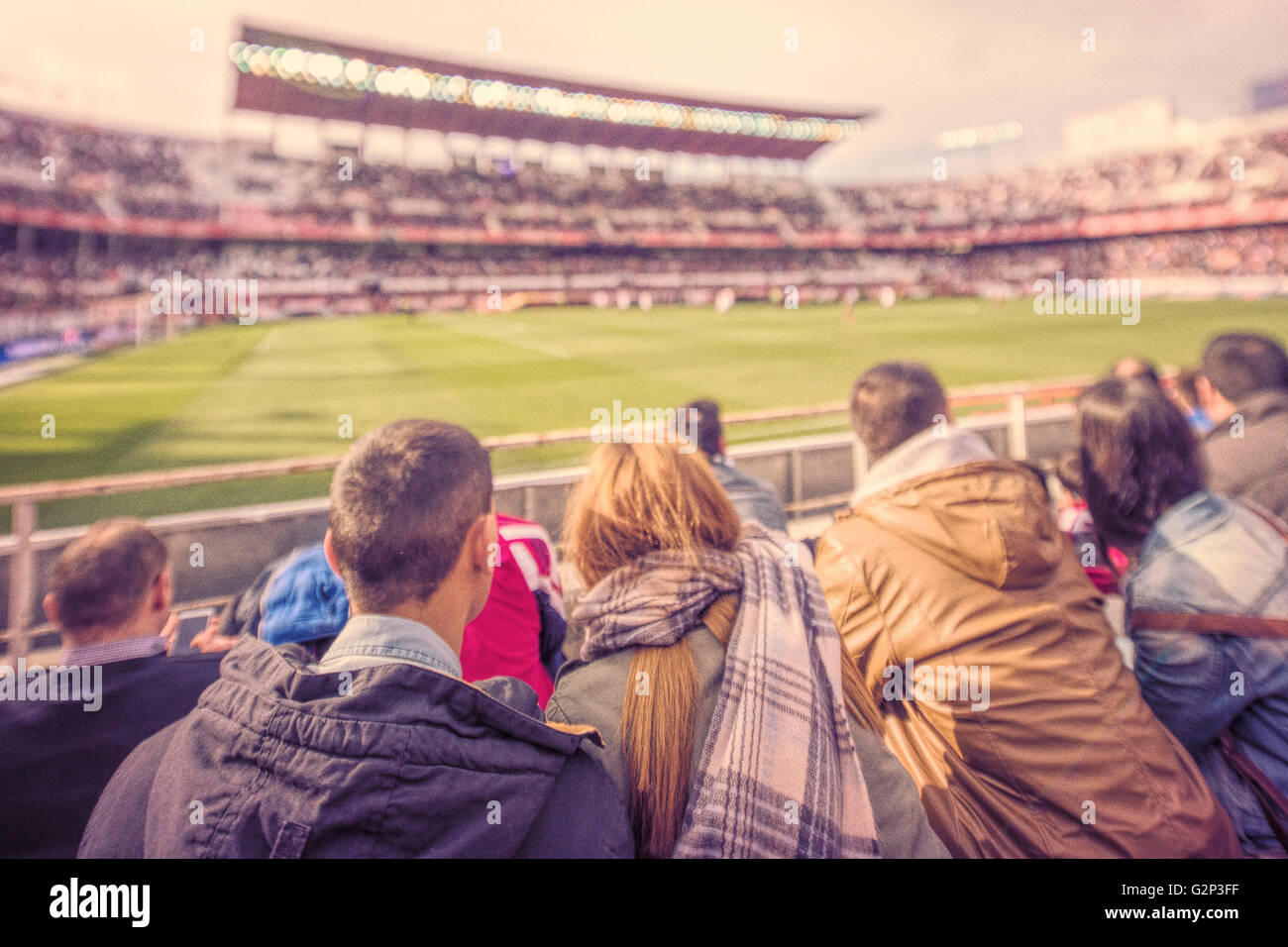 Spectators watching a football match. Ramon Sanchez-Pizjuan stadium ...