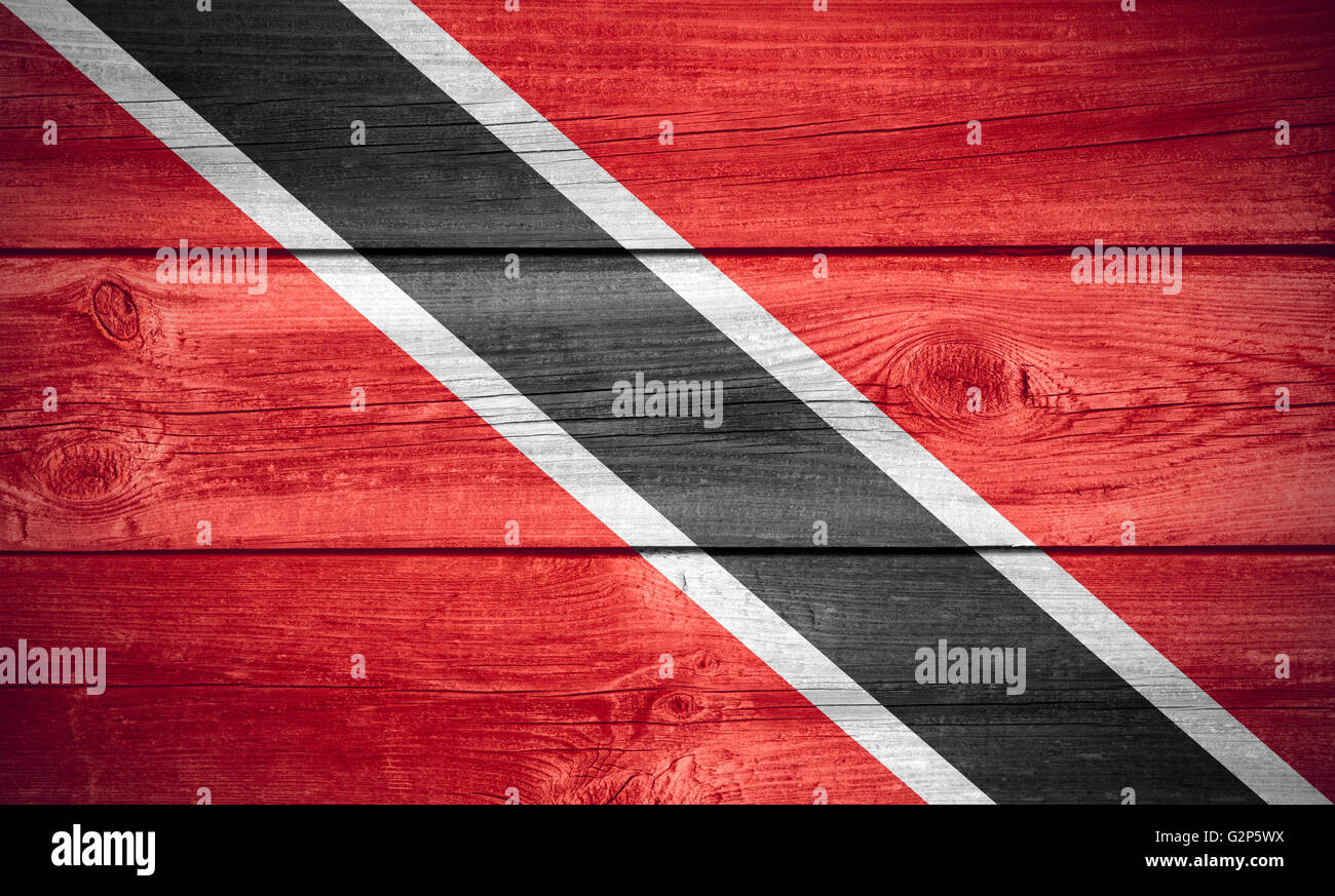 flag of Trinidad and Tobago or Trinidadians banner on wooden background ...