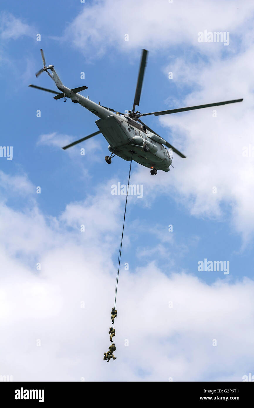 Military special forces during operation with a helicopter Stock Photo ...
