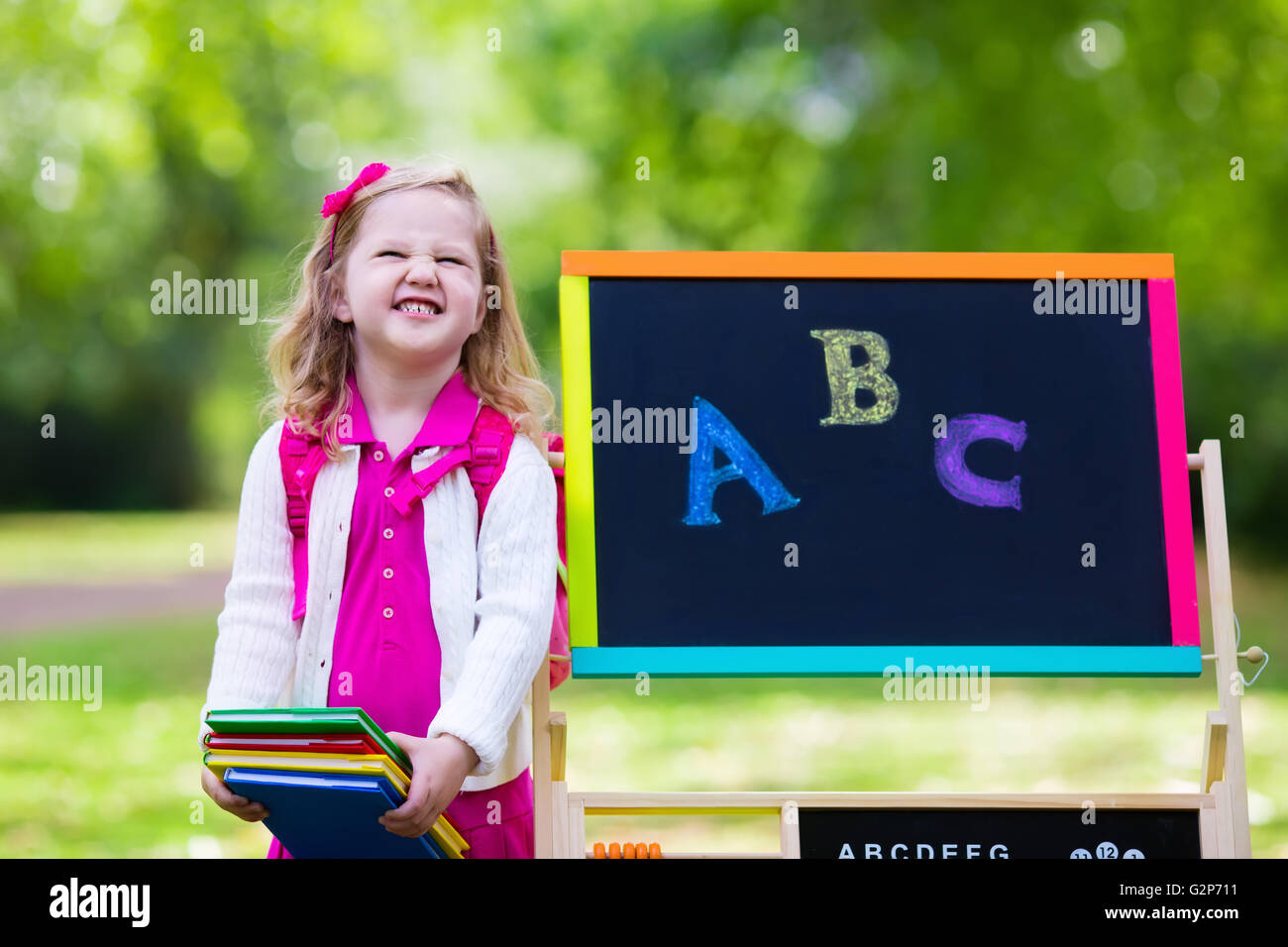 Children happy to be back to school. Preschooler girl and boy with ...