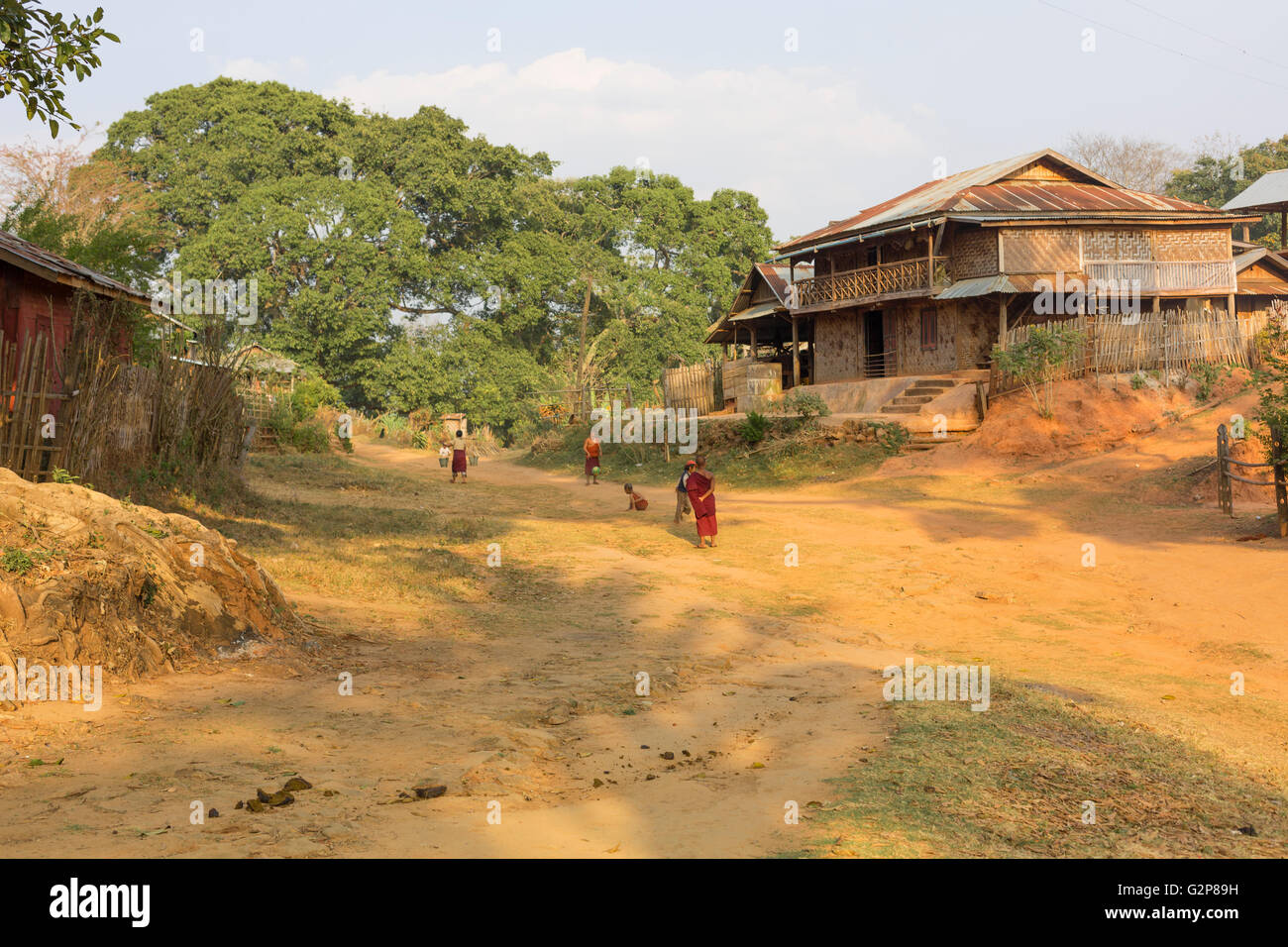 Shan village at sunset and children playing in the street. Countryside ...