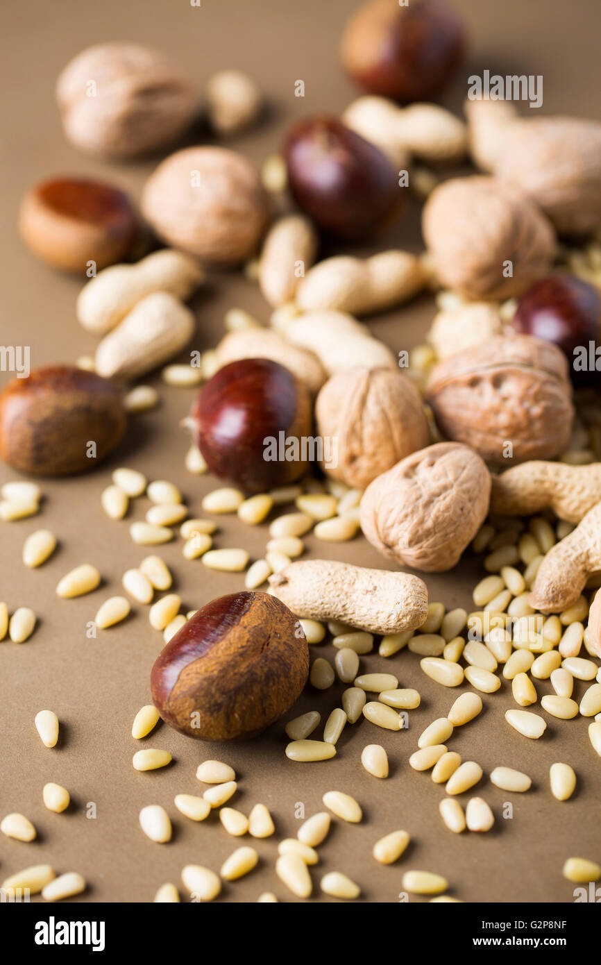 Various types of nuts scattered Stock Photo - Alamy
