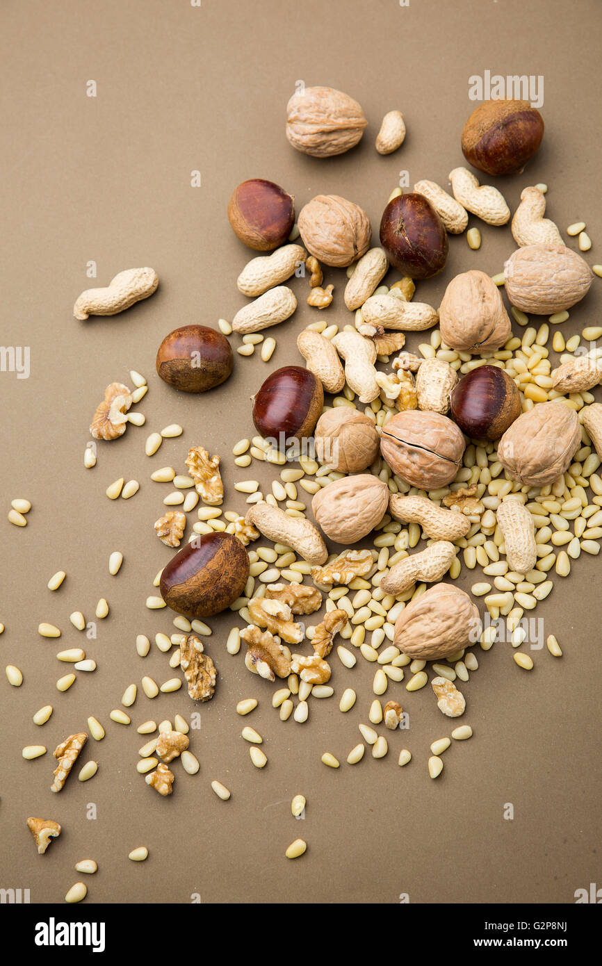 Various types of nuts scattered Stock Photo - Alamy