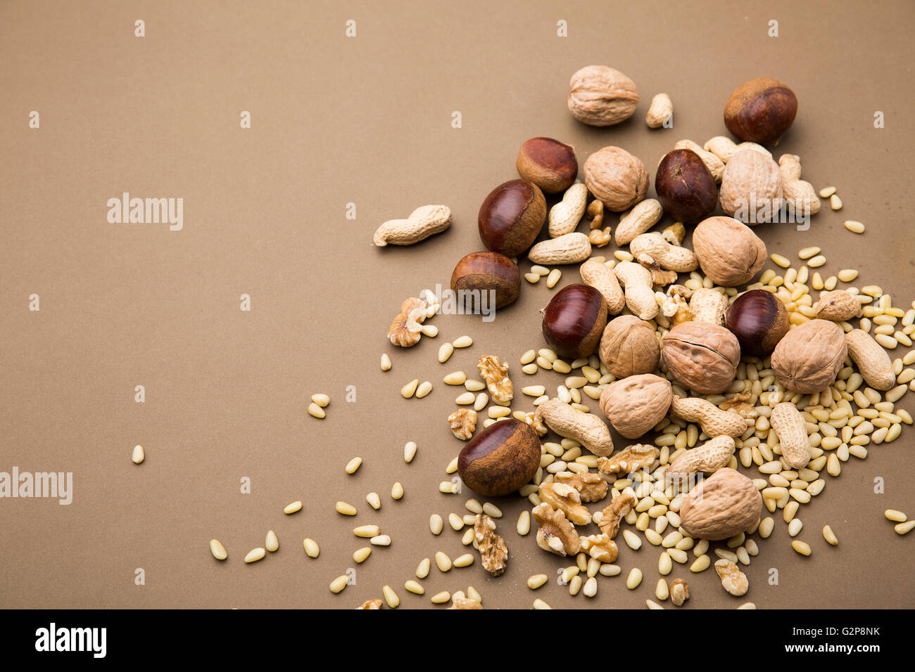 Various types of nuts scattered Stock Photo - Alamy