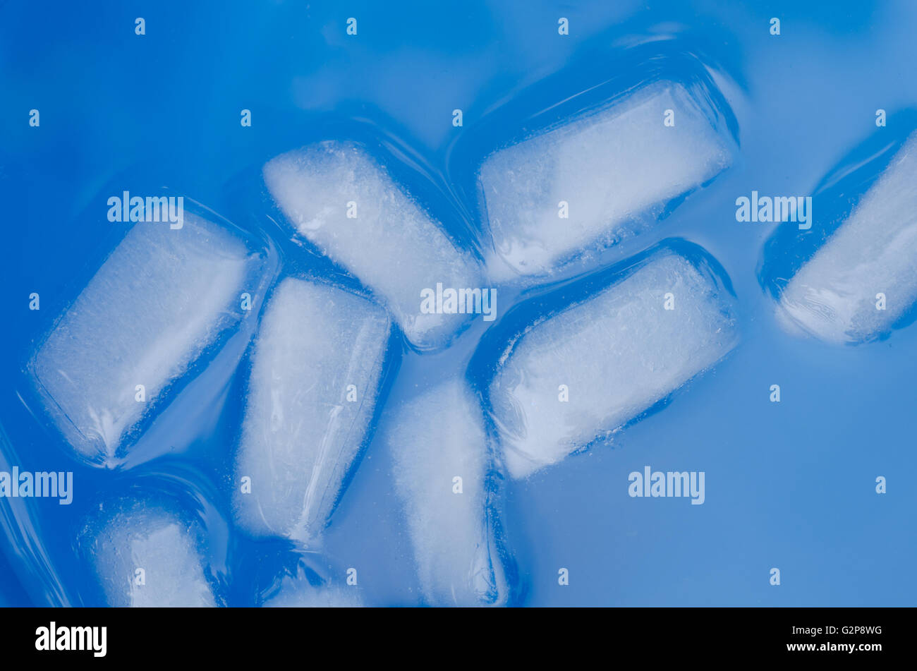 ice cubes in blue water Stock Photo - Alamy