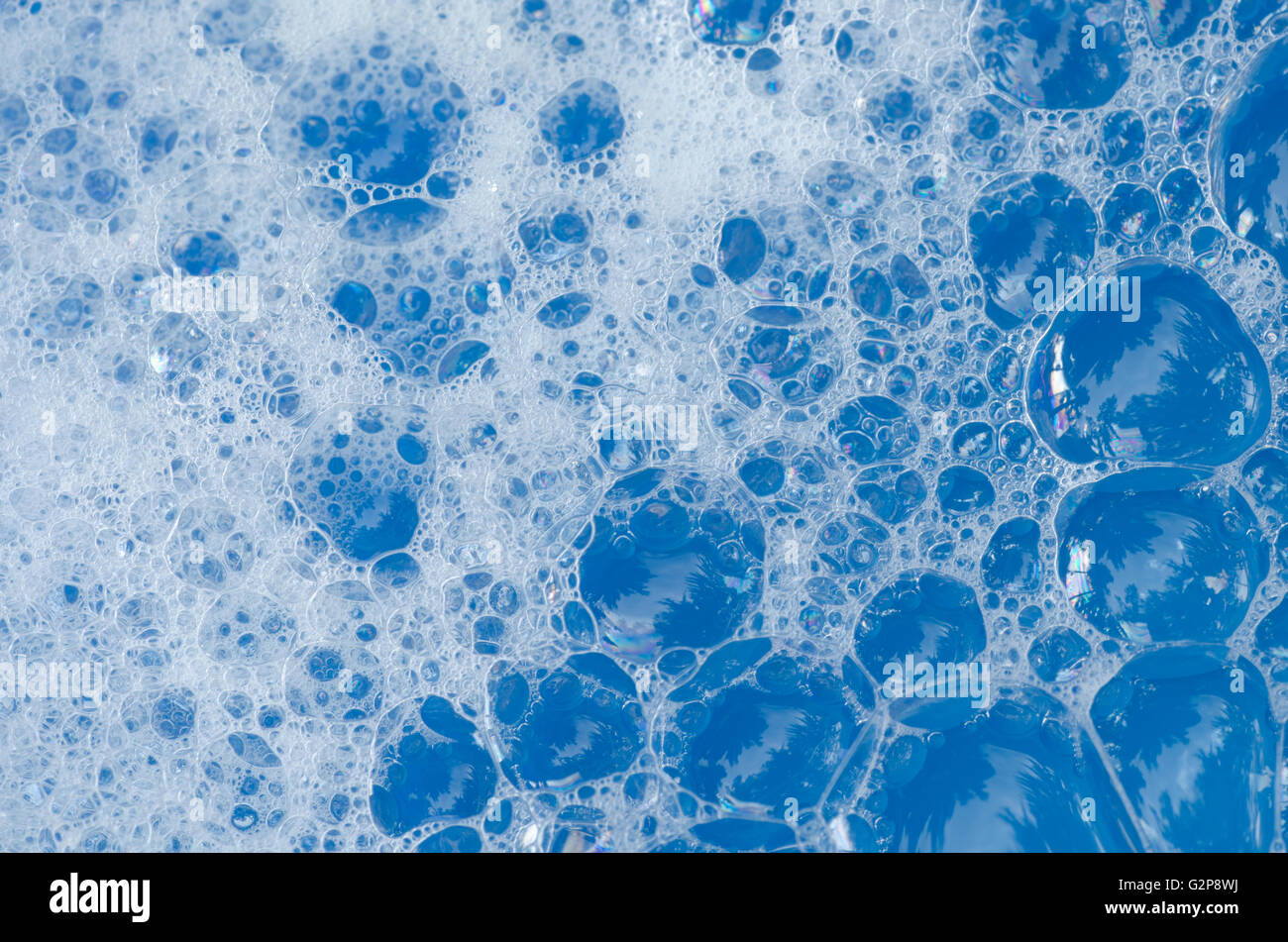 closeup to foam bubbles on blue background Stock Photo - Alamy