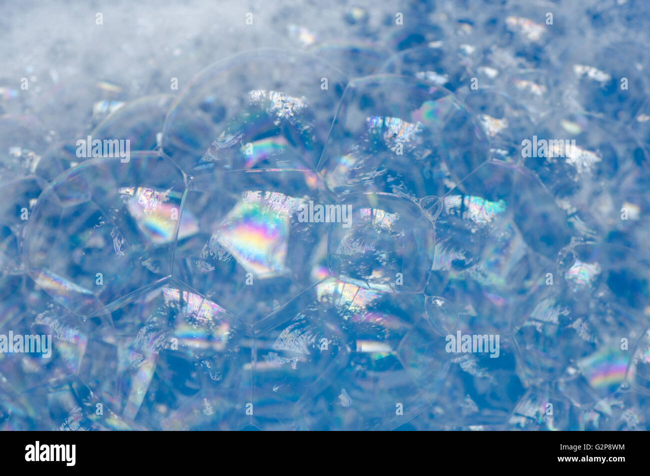 closeup to foam bubbles on blue background Stock Photo - Alamy