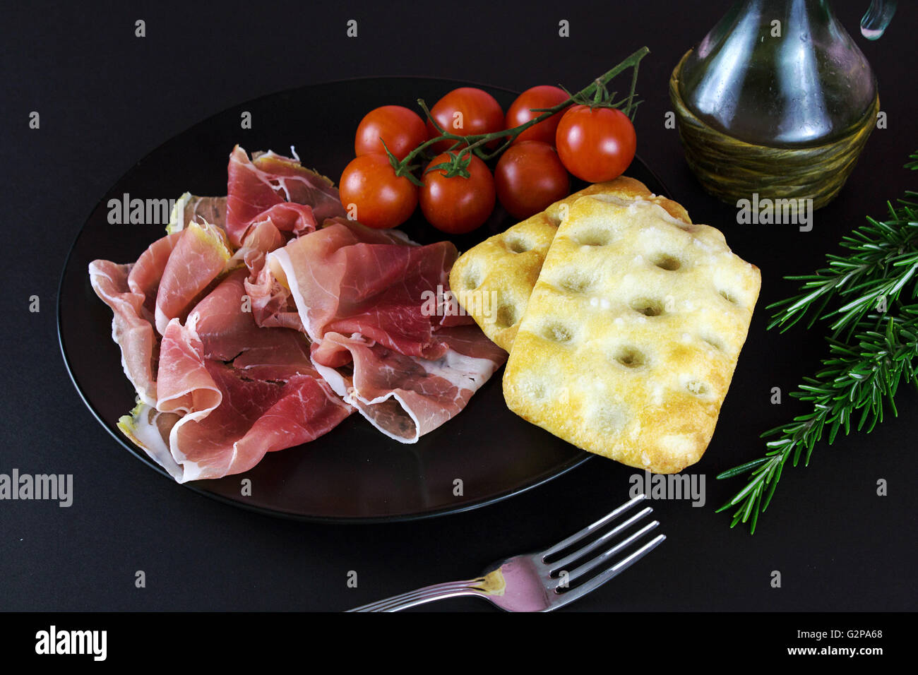A portion of Mediterranean focaccia appetizer with luxury Parma ham ...