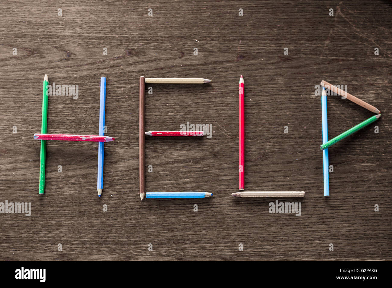 help. written with pencils Stock Photo - Alamy