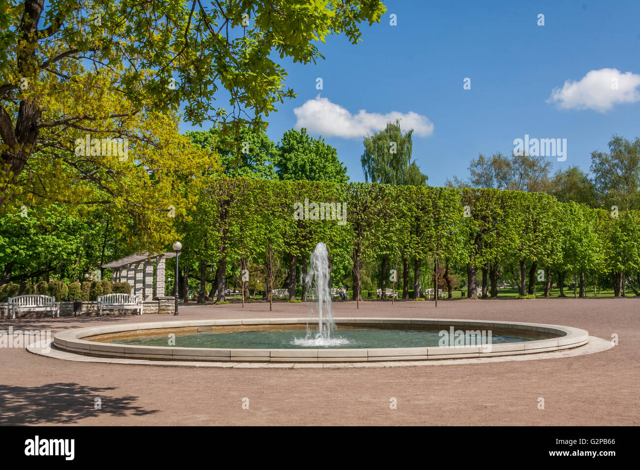 Fountain In The Spring Park Stock Photo - Alamy