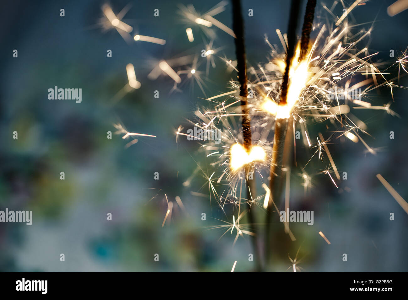 Burning Sparklers with colorful Confetti on wooden Table at a Party ...