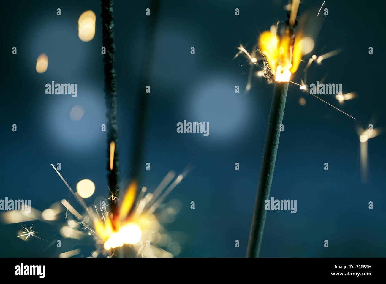 Burning Sparklers with colorful Confetti on wooden Table at a Party ...