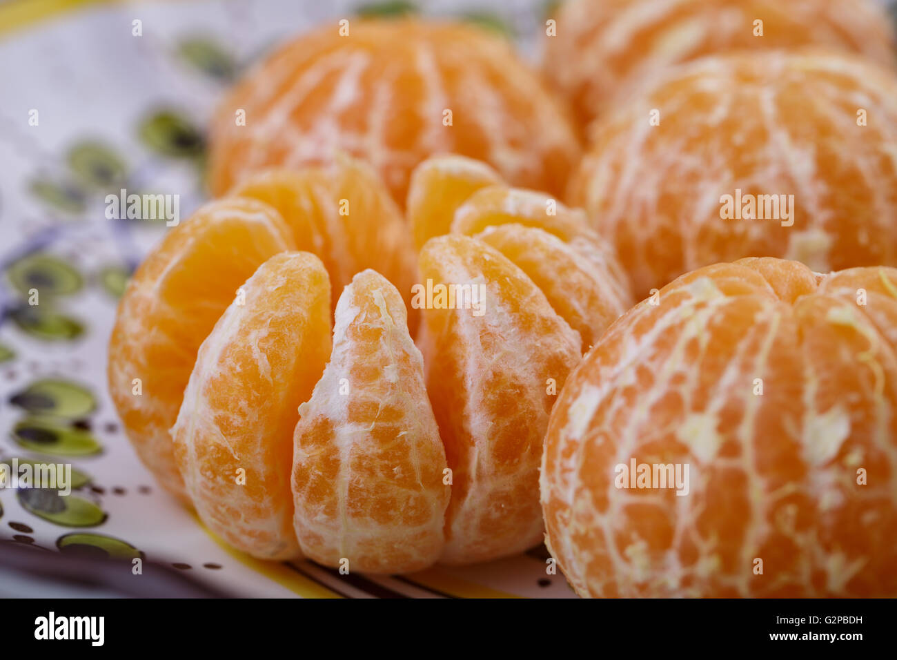 Bright Orange Mandarin with Green Leaf on Rustic Wooden board Stock ...