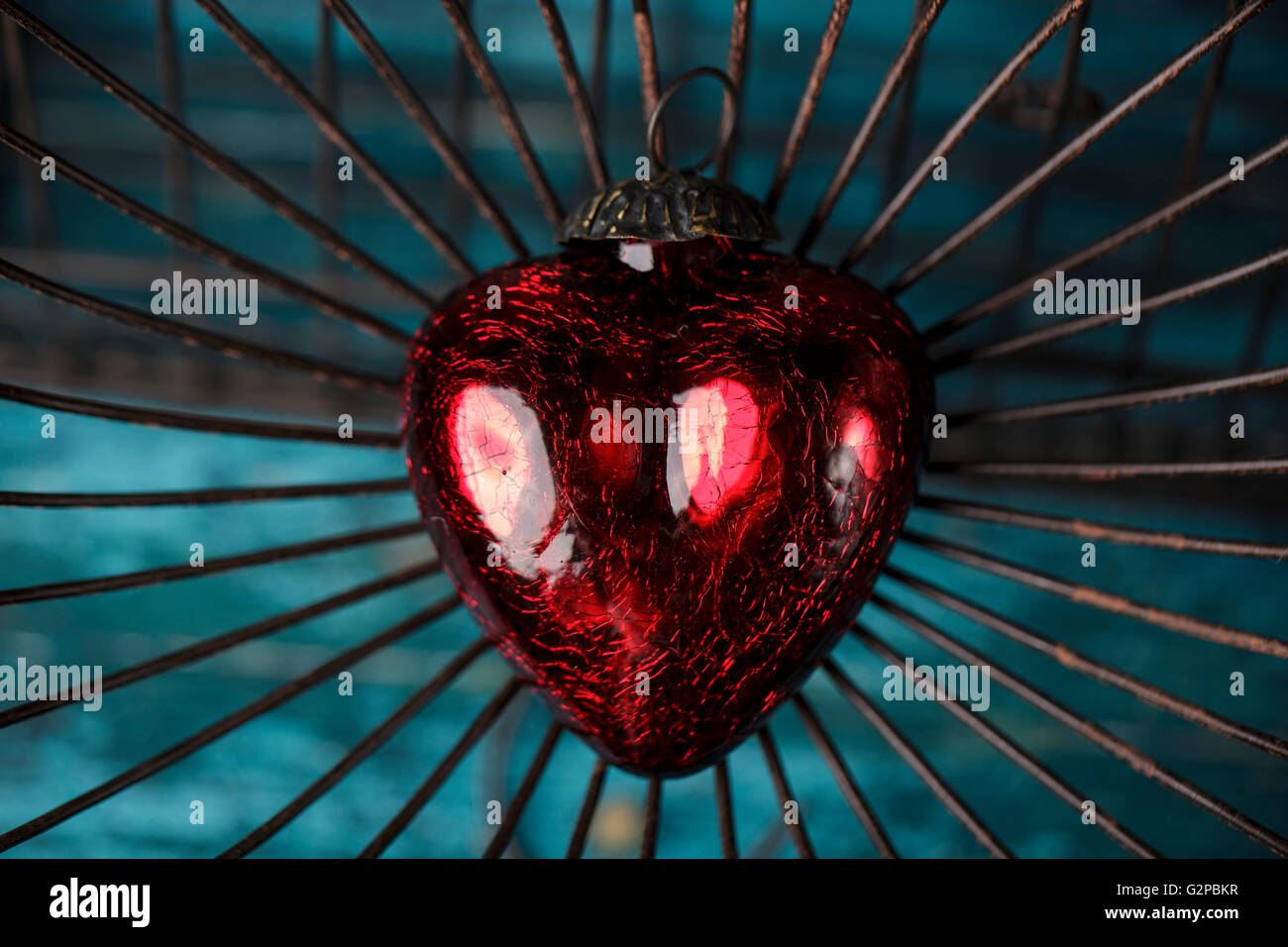 Red Heart trapped inside an old rusty bird cage Stock Photo - Alamy