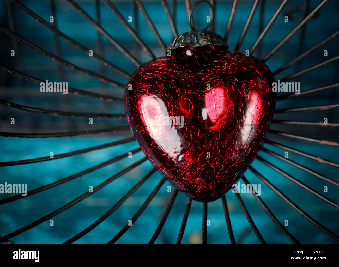 Red Heart trapped inside an old rusty bird cage Stock Photo - Alamy