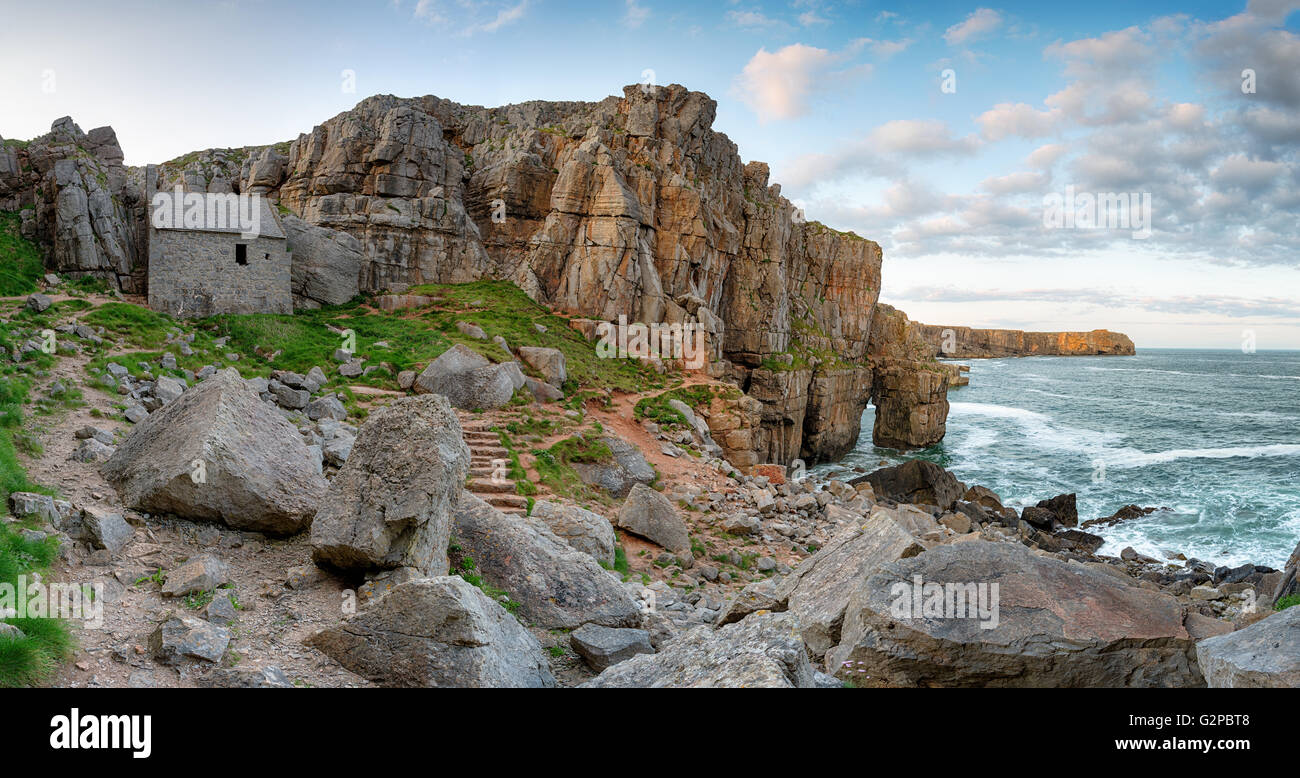 St Govan's Chapel, a tiny hermit cell built in to limestone cliffs on ...