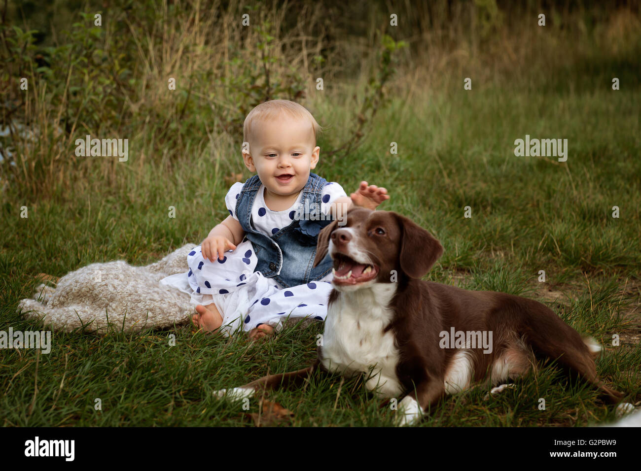 Baby girl and dog hi-res stock photography and images - Alamy