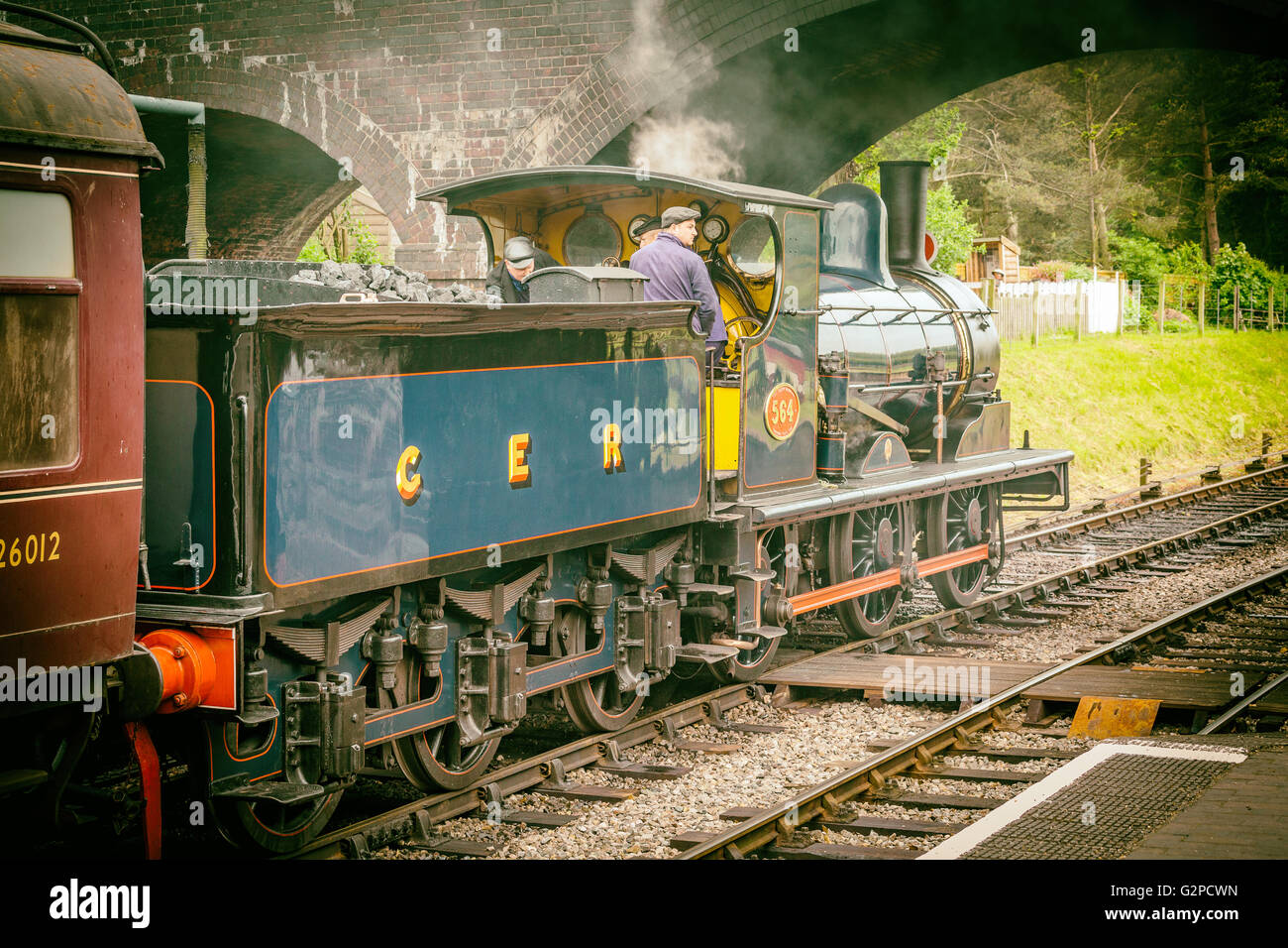 Steam Train passing under a bridge on the North Norfolk railway Stock ...